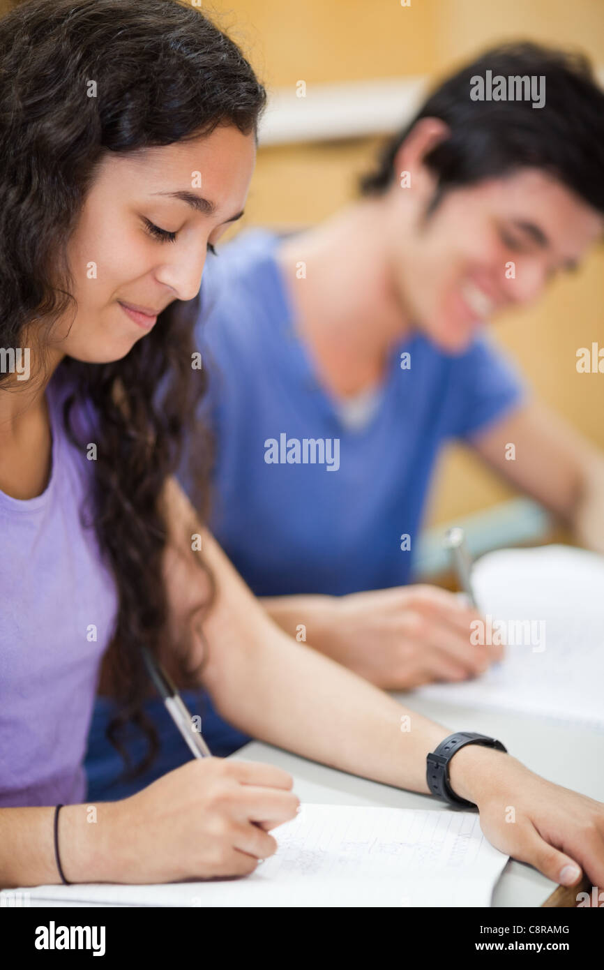 Portrait of students writing Stock Photo - Alamy