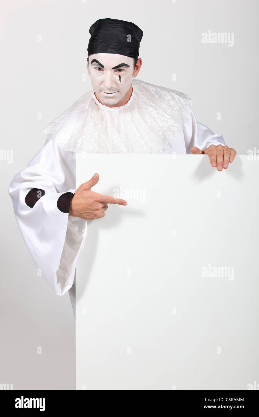 Clown pointing at white board Stock Photo - Alamy