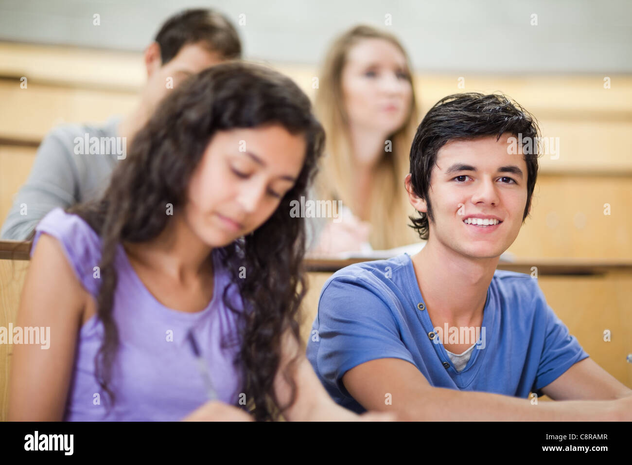 Student being distracted while his classmates are listening Stock Photo ...