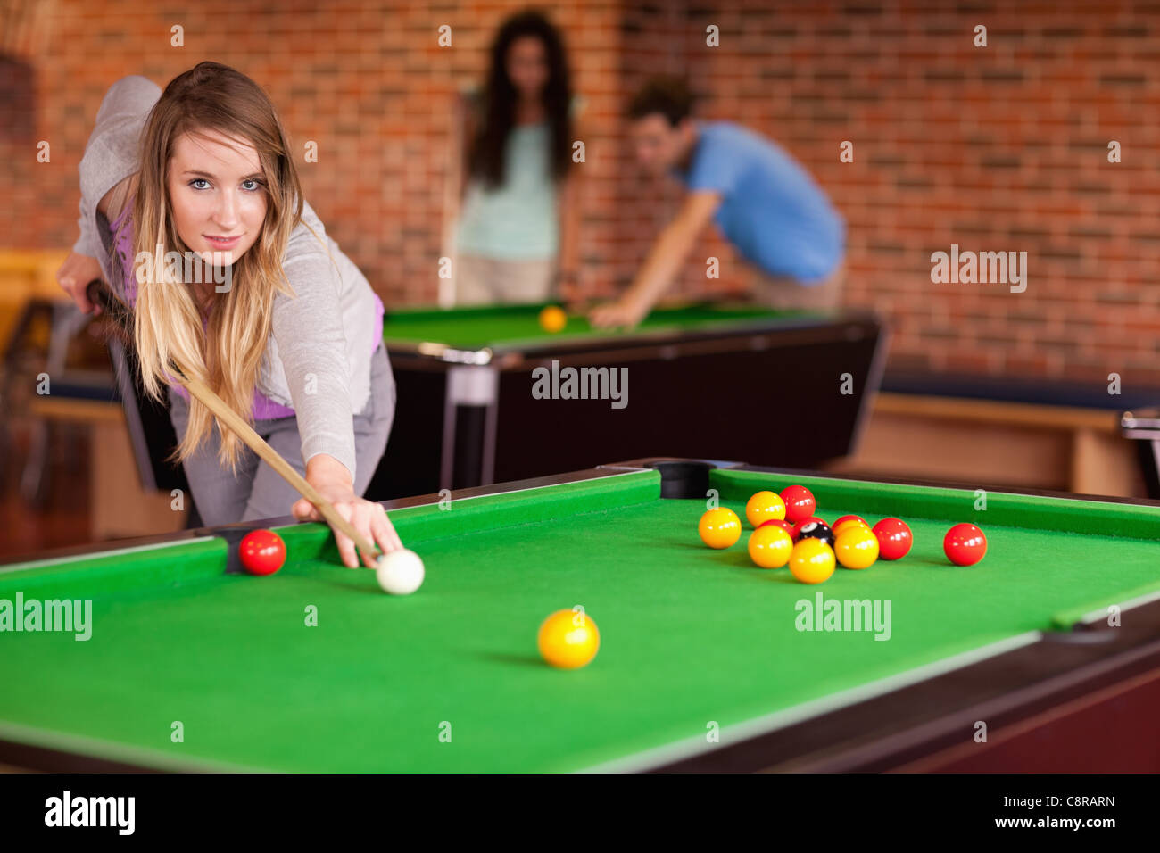 Student woman playing snooker Stock Photo - Alamy