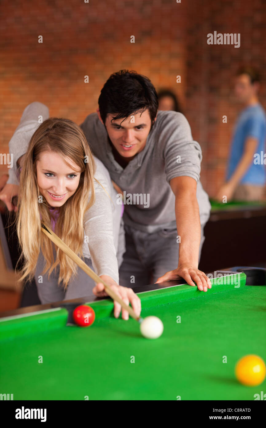 Portrait of a couple playing snooker Stock Photo - Alamy