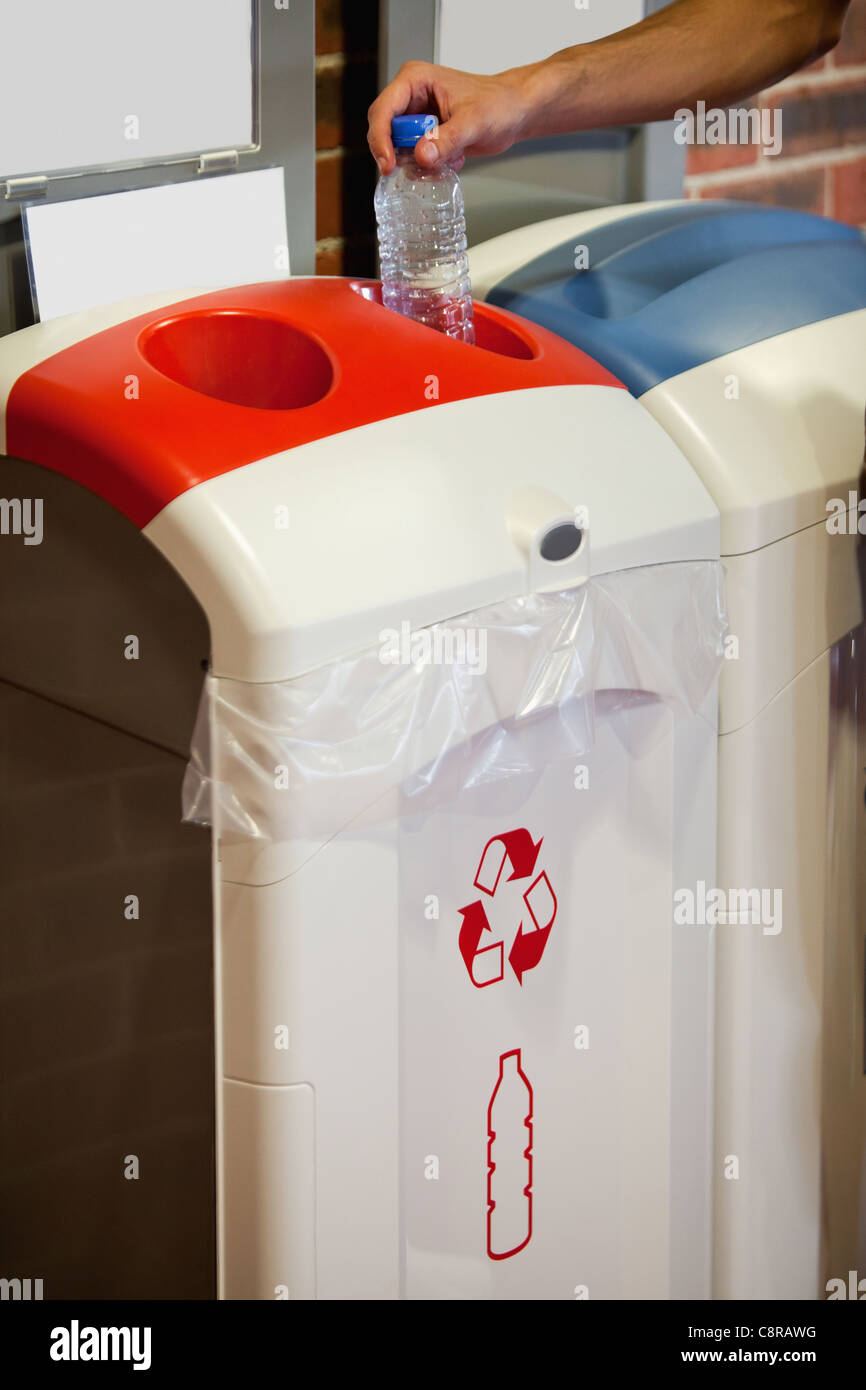 Portrait of a manly hand recycling Stock Photo - Alamy