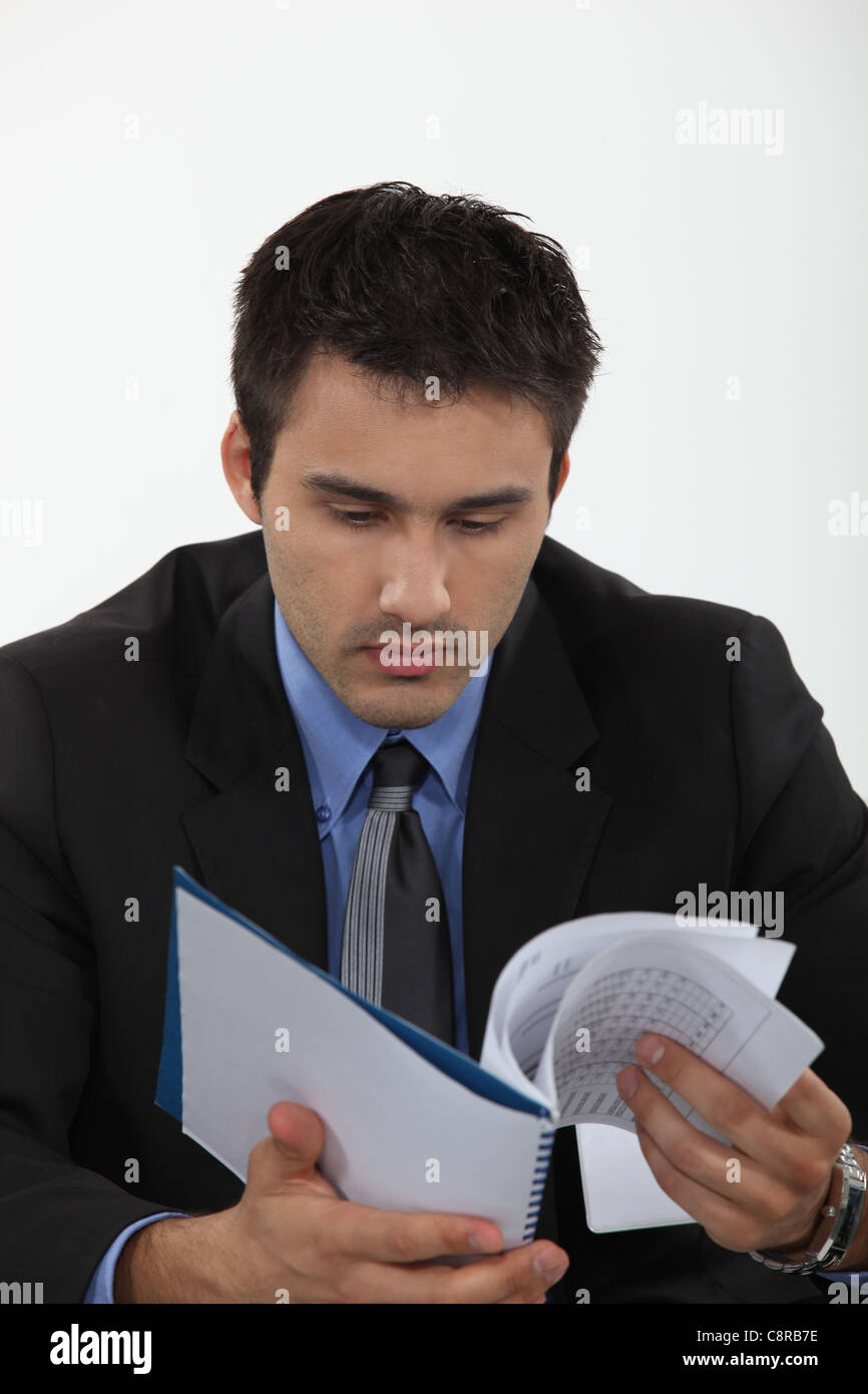 A businessman reading notes Stock Photo - Alamy