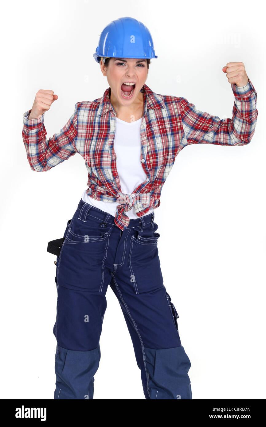 Cheering construction worker Stock Photo - Alamy