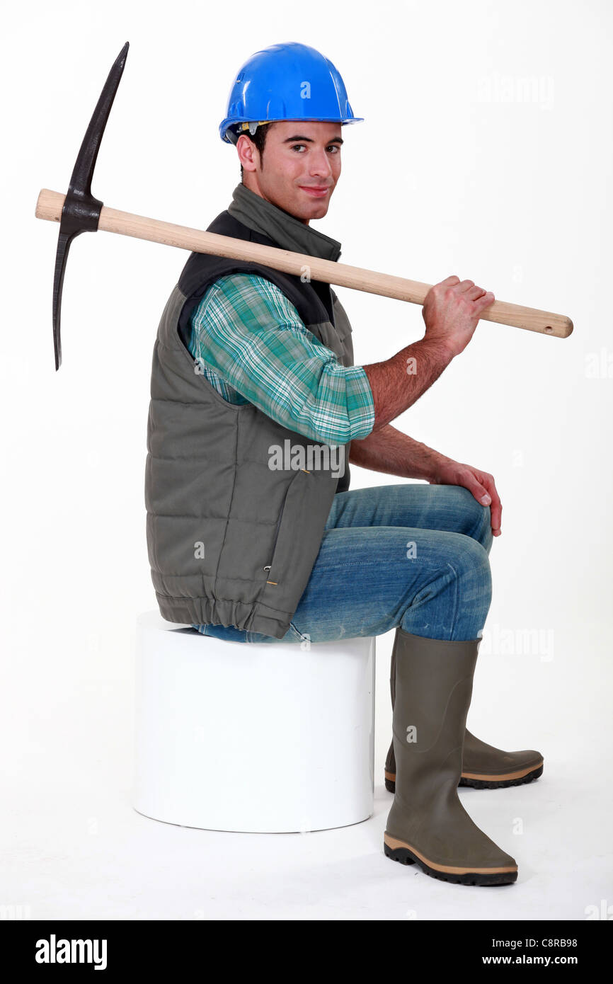Building worker with pickaxe Stock Photo - Alamy