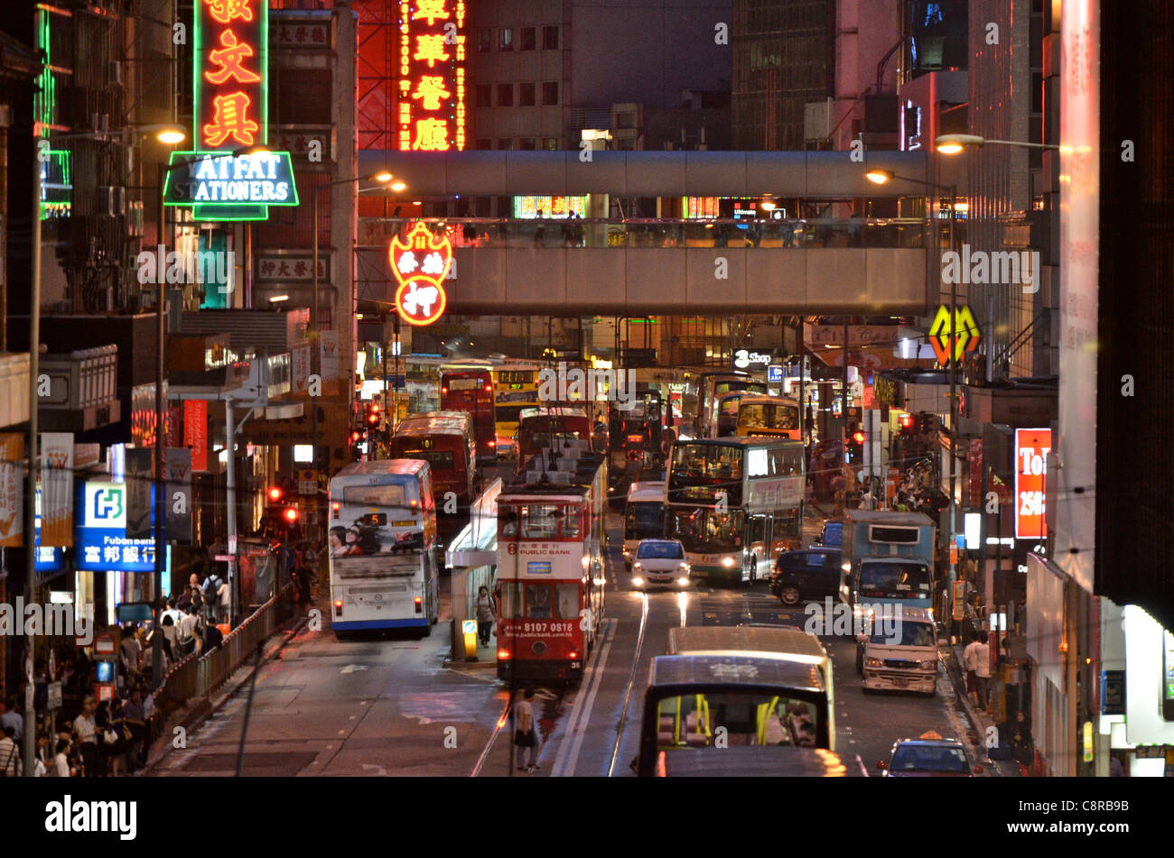 A typical Hong Kong street scene of neon lights and traffic congestion ...