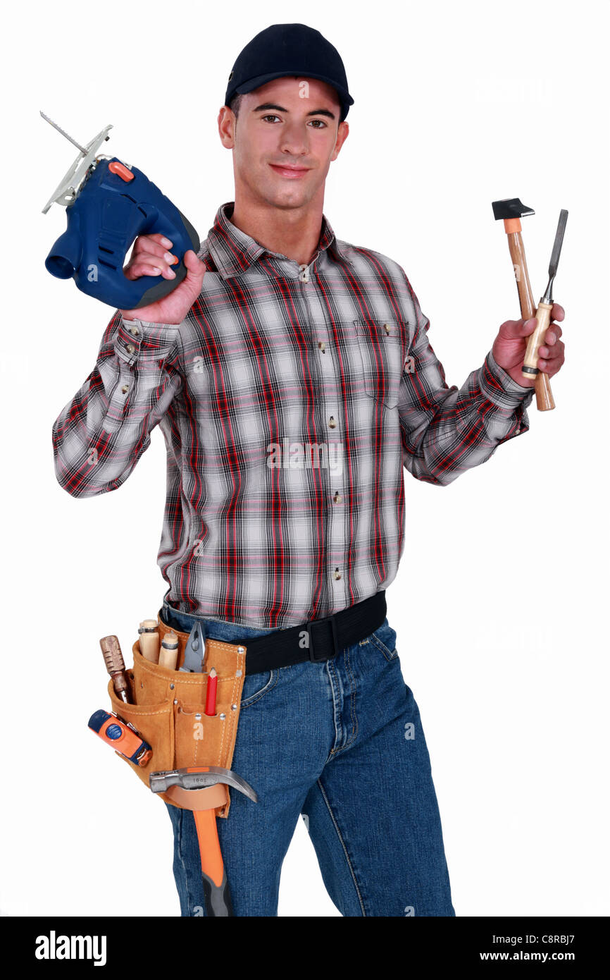 portrait of carpenter holding drill and hammer Stock Photo - Alamy