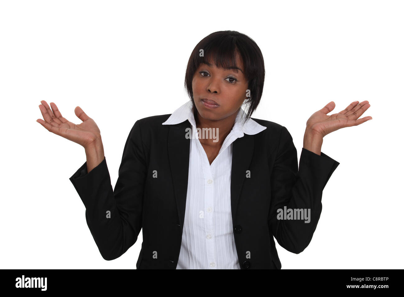 Young woman shrugging, studio shot Stock Photo - Alamy