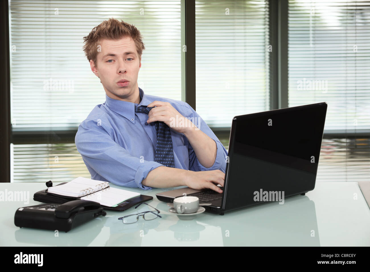 Office worker getting tired Stock Photo - Alamy