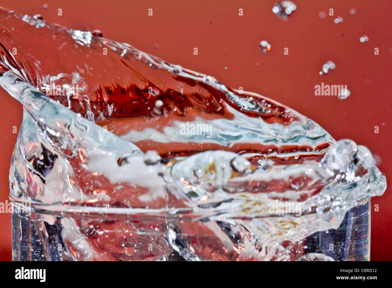 The motion flowing into a glass forming frozen in time Stock Photo - Alamy