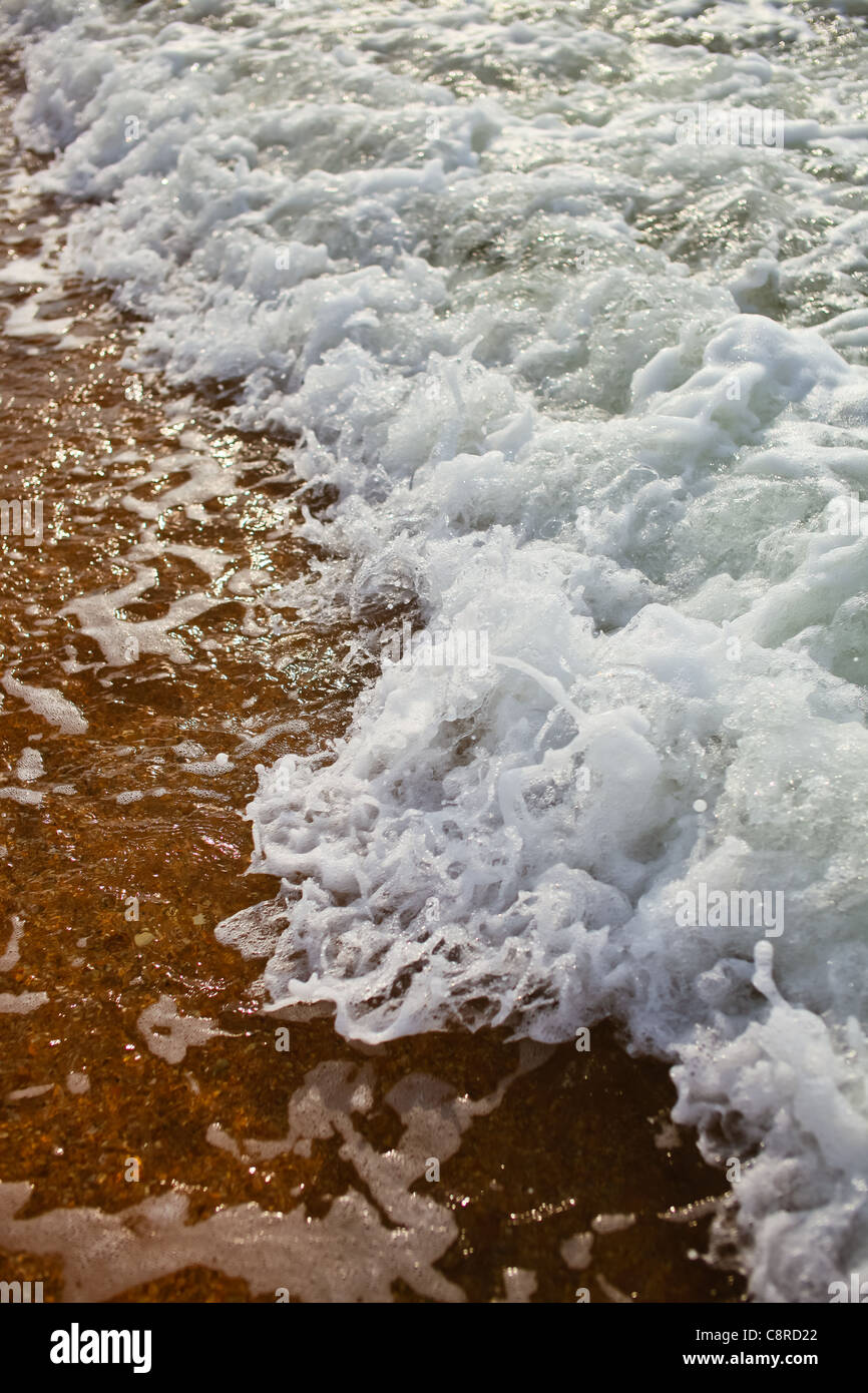 Crashing sea waves on the beach background Stock Photo - Alamy