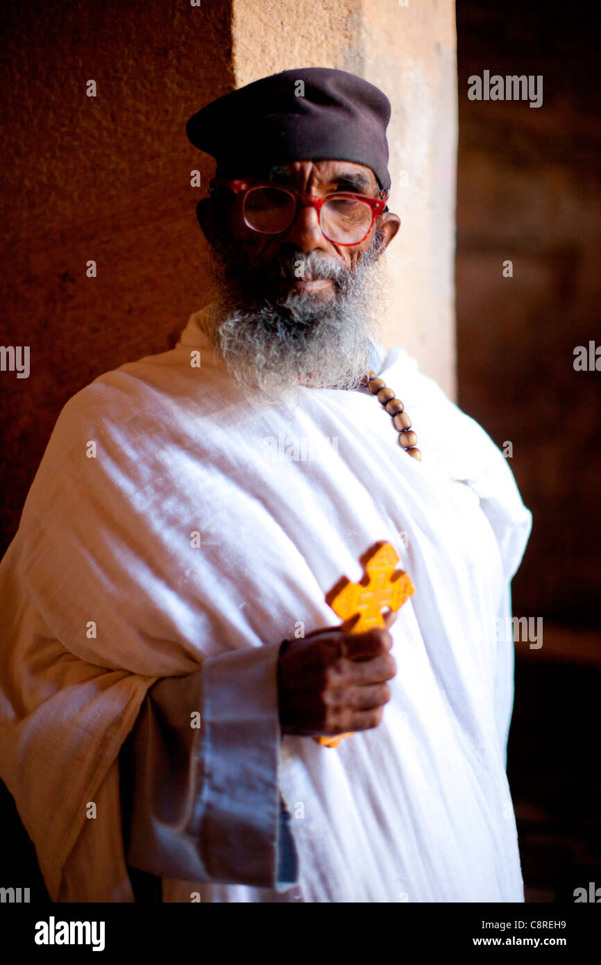 Portrait of an Orthodox Christian priest standing in the doorway at the ...