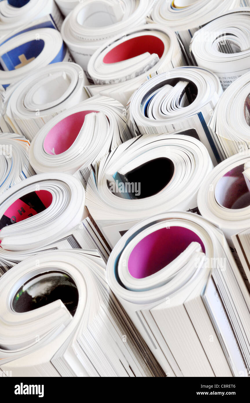 Bulk of rolled up magazines Stock Photo - Alamy