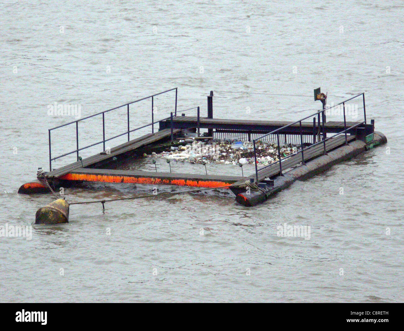 Floating bin on the river Thames, a rubbish collector launched to clear ...