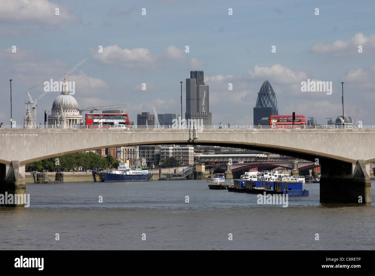Waterloo Bridge showing St Paul's The Gherkin and double decker buses ...