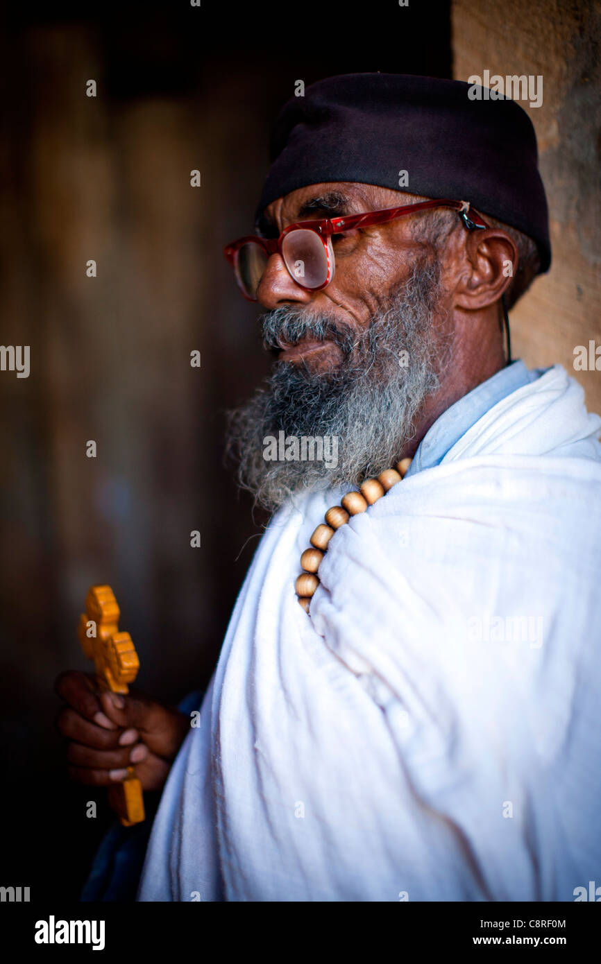 Portrait of an Orthodox Christian priest standing in the doorway at the ...