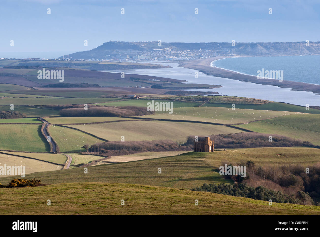 Chesil Beach and the Portland headland with the chapel of St Catherine ...