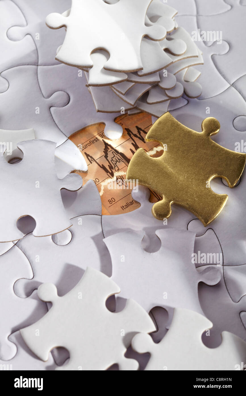 Close-up Of White Jigsaw With Golden Jigsaw Stock Photo - Alamy