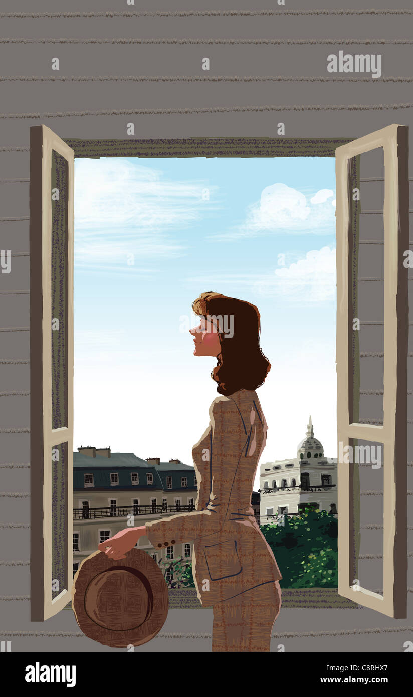 Woman standing near window Stock Photo - Alamy