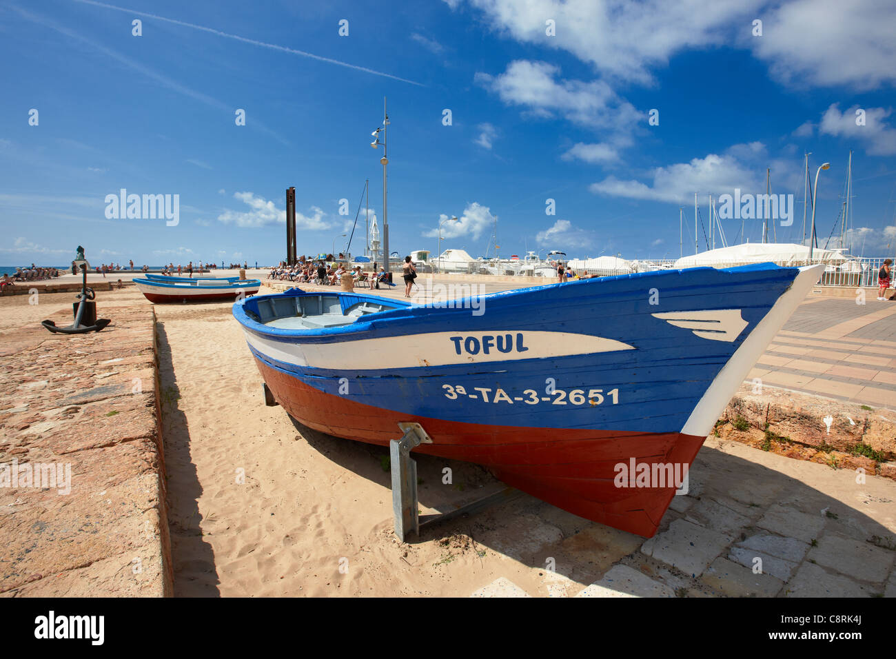 A wooden boat on the sandy Llevant beach in Salou, Catalonia, Spain ...
