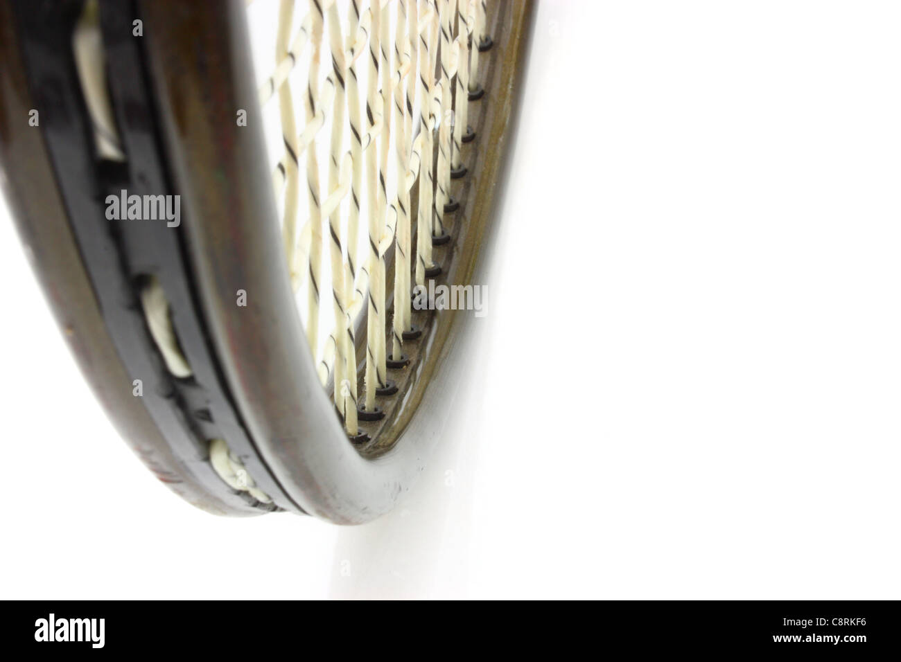 Tennis racket of brown color on a white background Stock Photo - Alamy