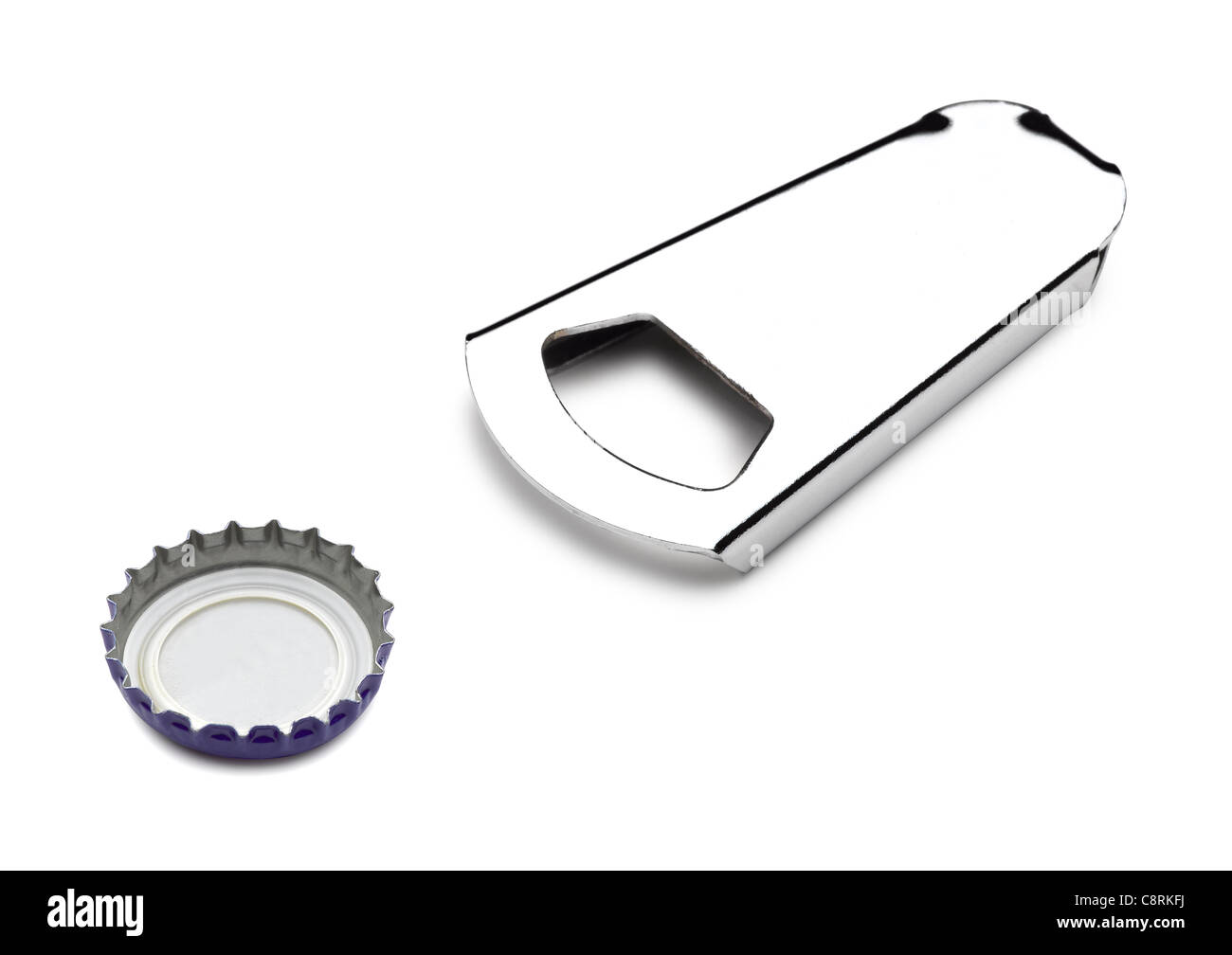 close up of bottle opener and cap on white background with clipping ...