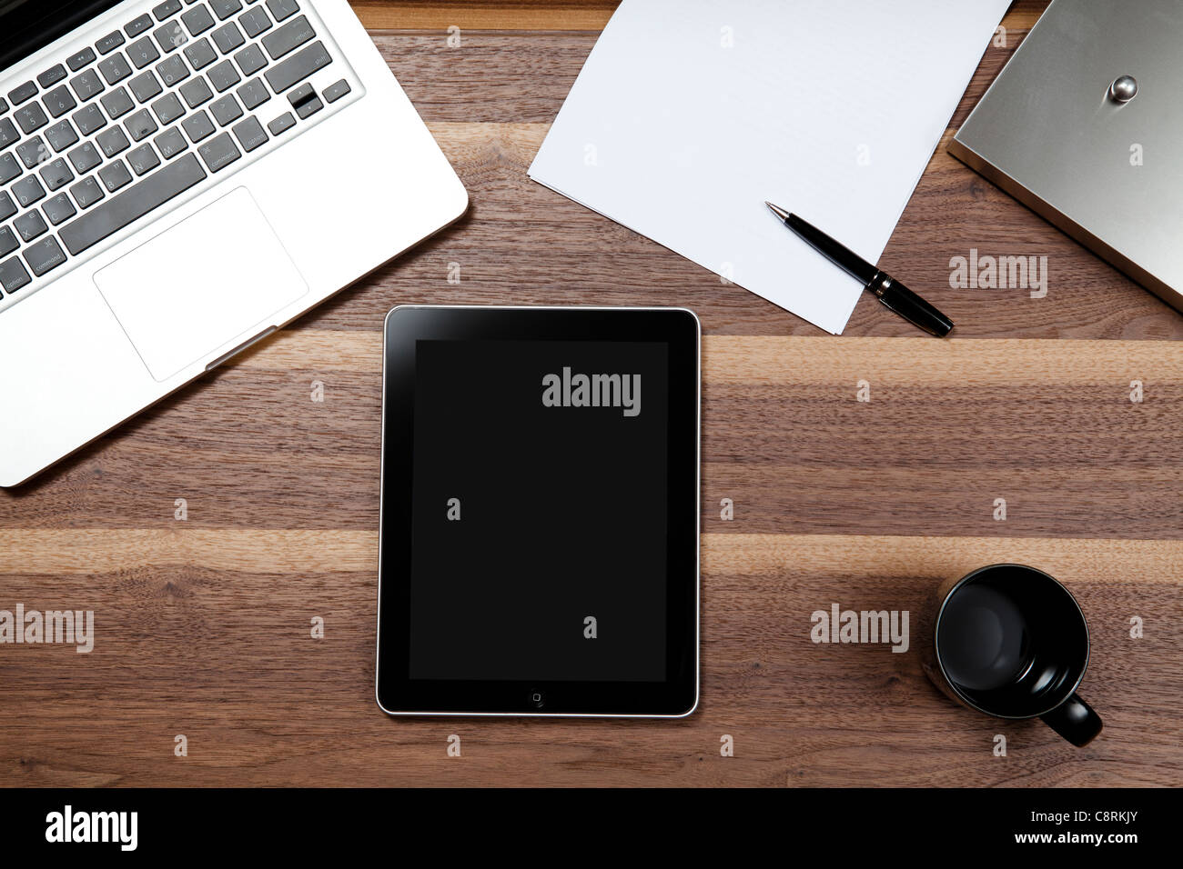 Laptop With Paper, Cup And Pen Stock Photo - Alamy