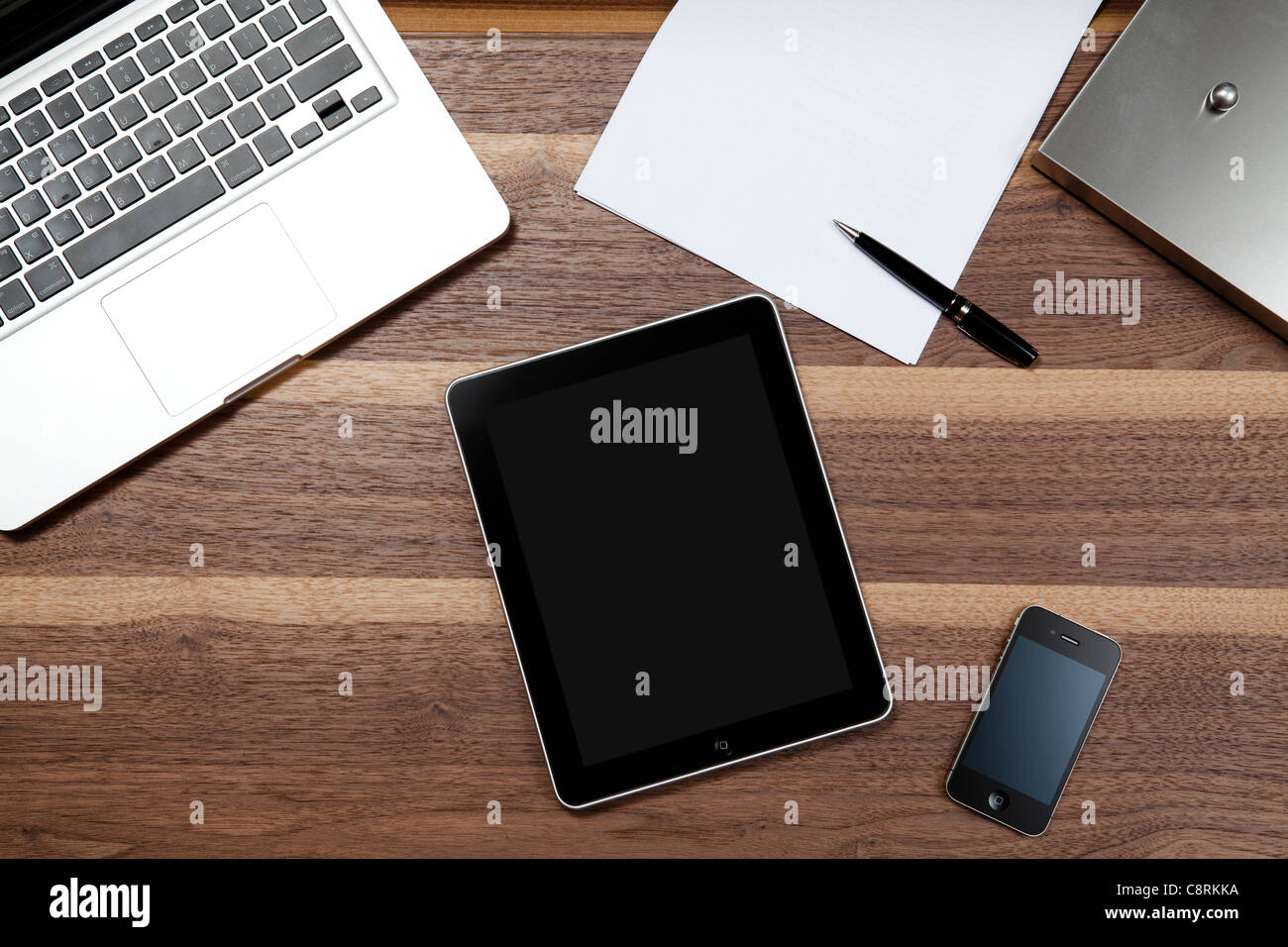 Laptop With Paper, Mobile, And Pen Stock Photo - Alamy