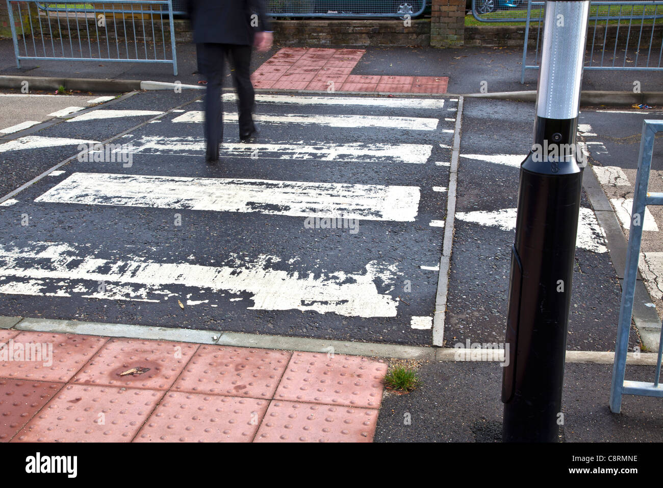 Unidentified Man Walking Across Zebra Crossing Stock Photo - Alamy