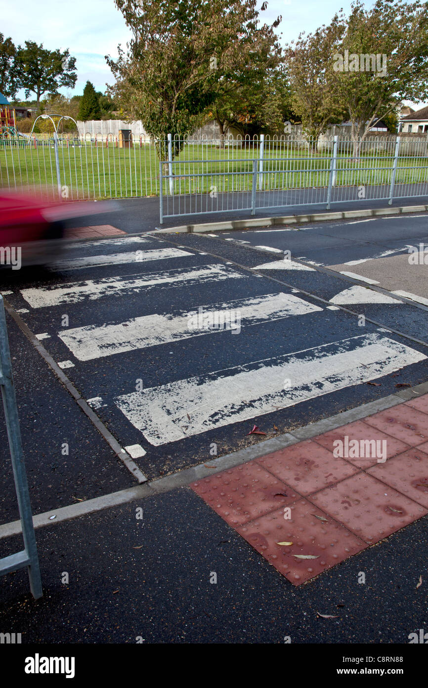 Car Just About to Drive Over Zebra Crossing Stock Photo - Alamy