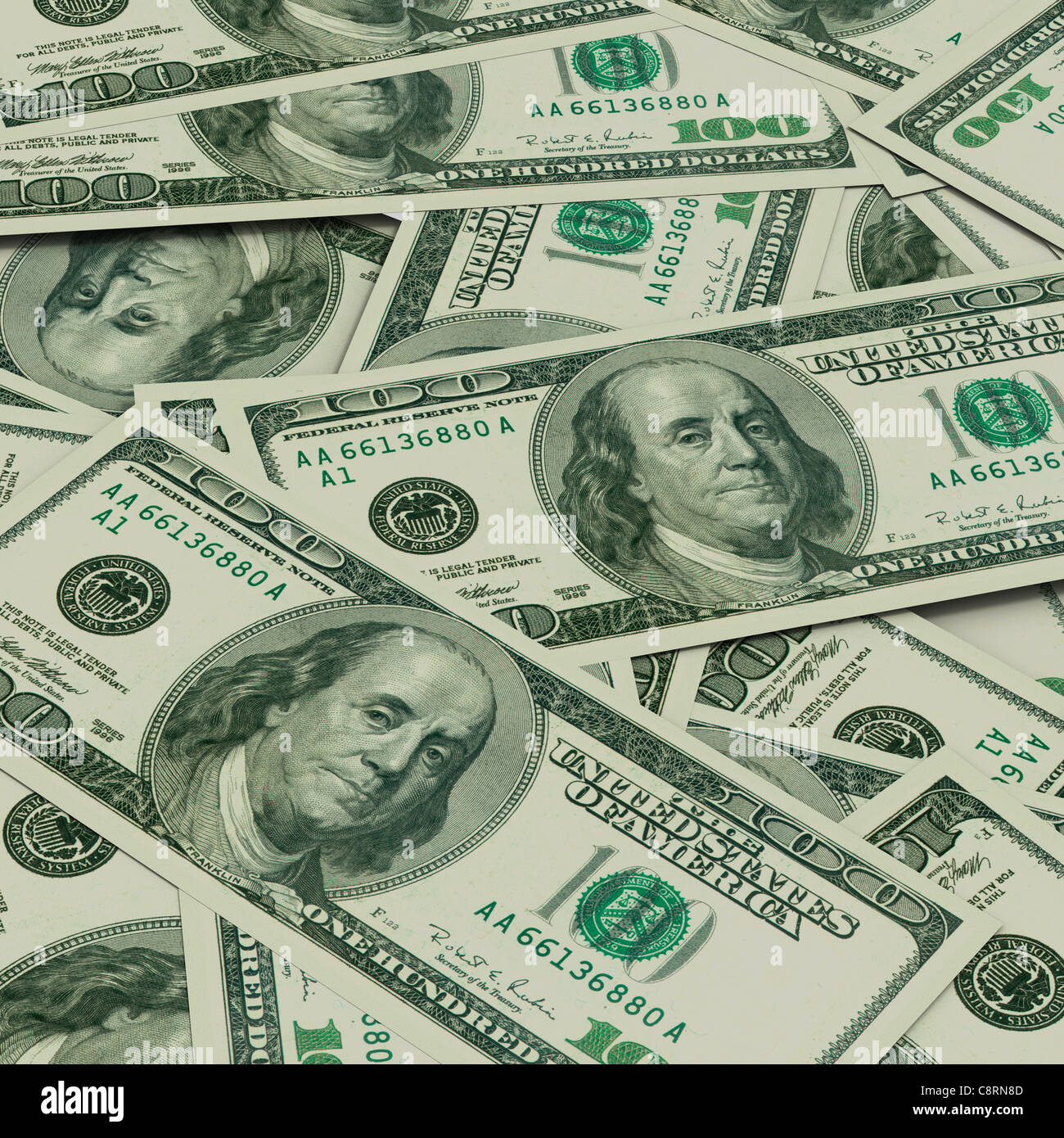 Hundred dollar notes forming an extensive background with perspective ...