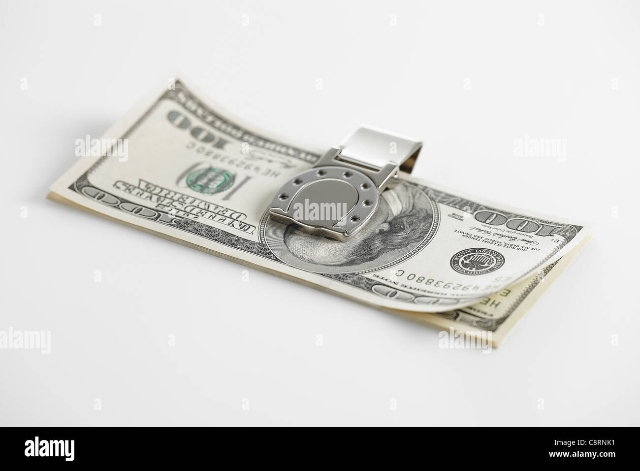 American one hundred-dollar bills in money clip Stock Photo - Alamy