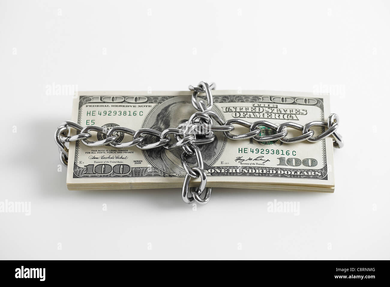 Bundle of American one hundred-dollar bills tied with metal chain Stock ...