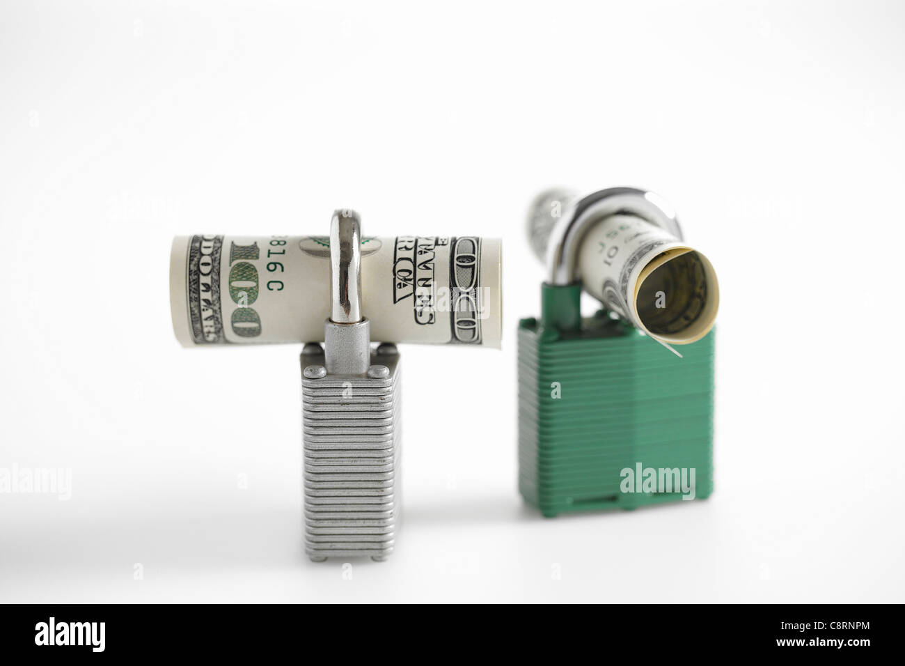 Two bundle of currency notes in a pad lock Stock Photo - Alamy