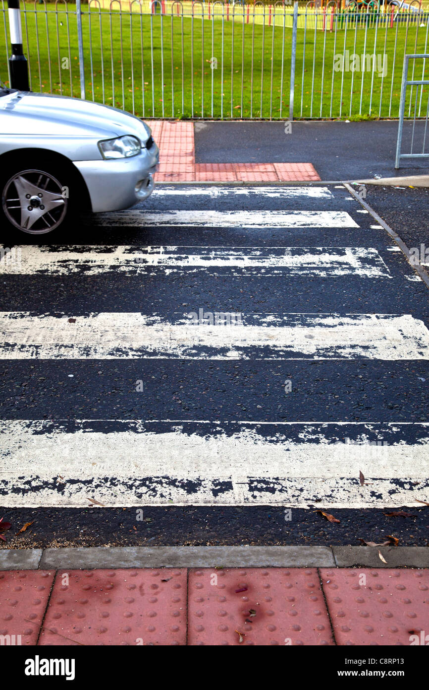 Car Driving Over Zebra Crossing Stock Photo - Alamy