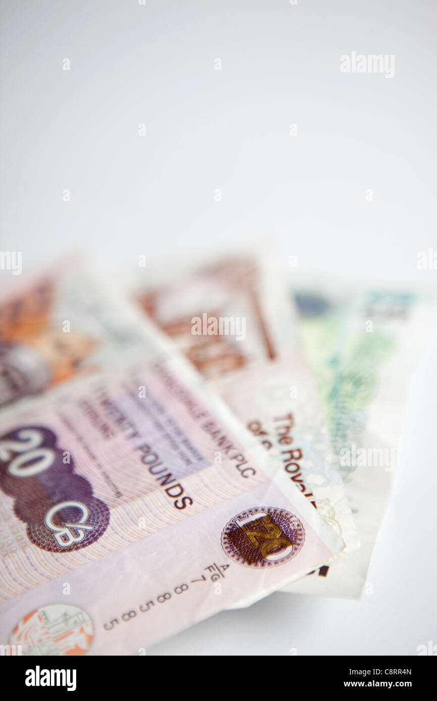 Three money notes against a plain white background Stock Photo - Alamy