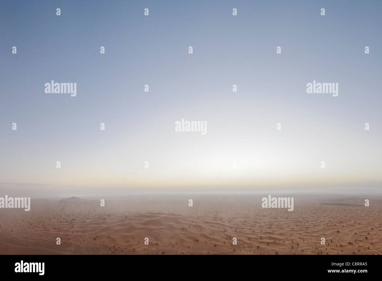 Africa, Tunisia, Tembaine. Misty daybreak in the Sahara desert, seen ...
