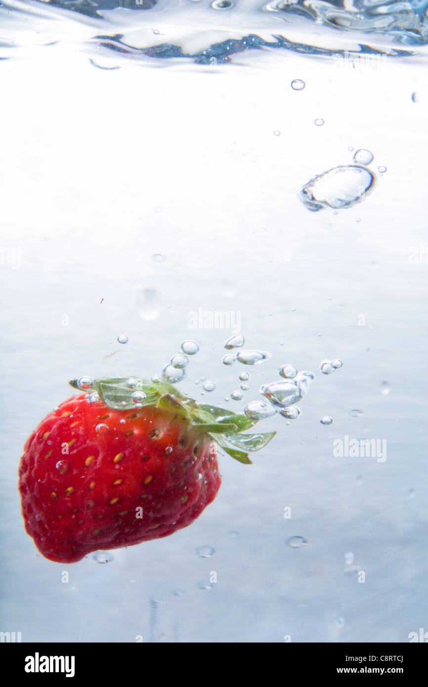 Strawberry Splashing in Water Stock Photo - Alamy
