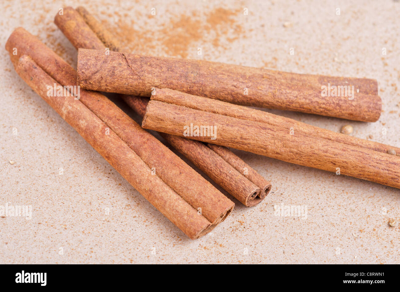 Cinnamon stick closeup on a brown background Stock Photo - Alamy