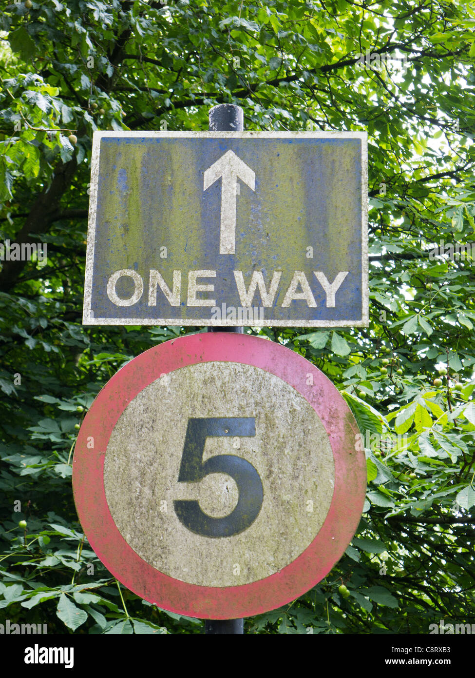 Moss-covered traffic signs Stock Photo - Alamy