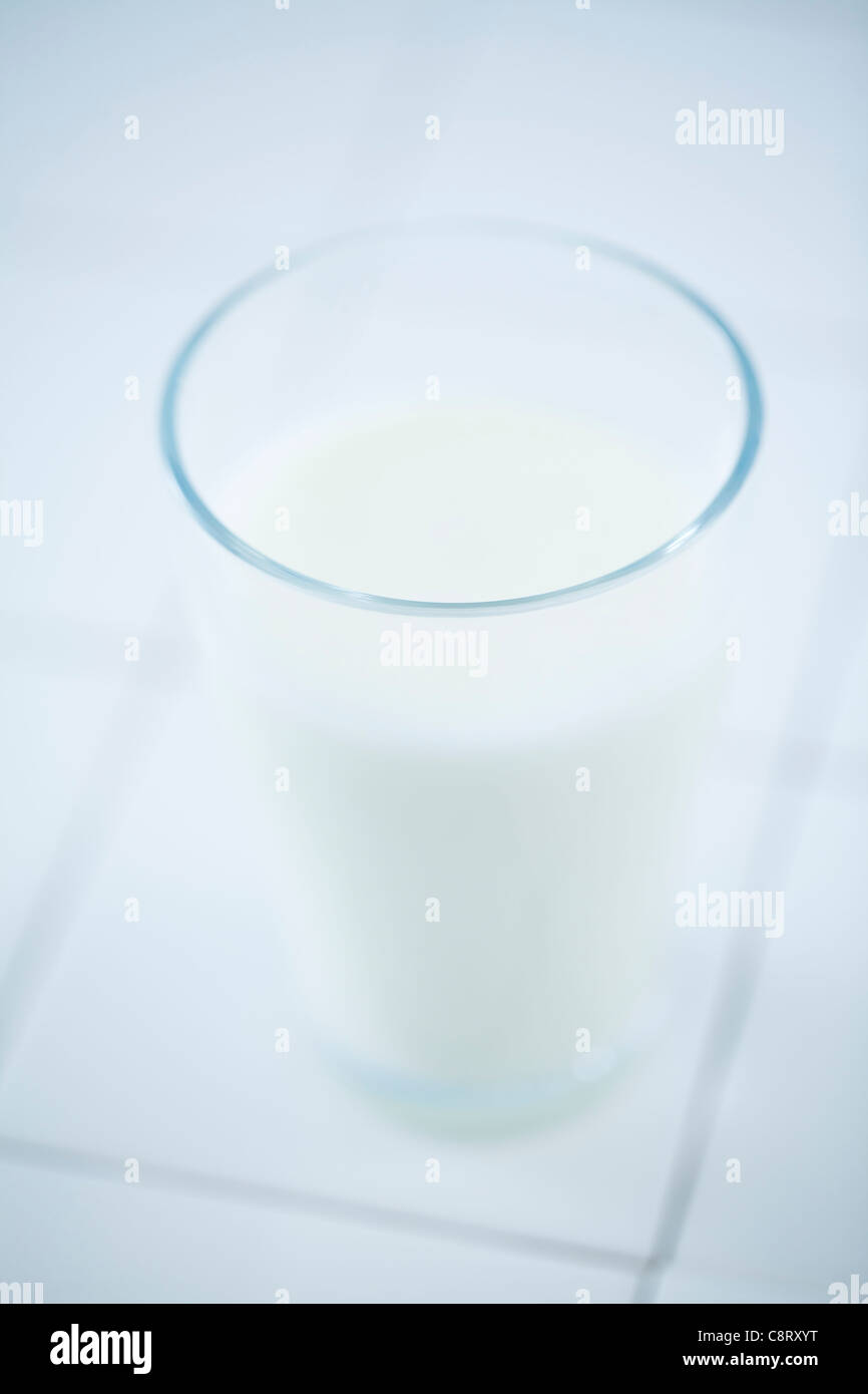 Close-up of a glass of milk on white background Stock Photo - Alamy