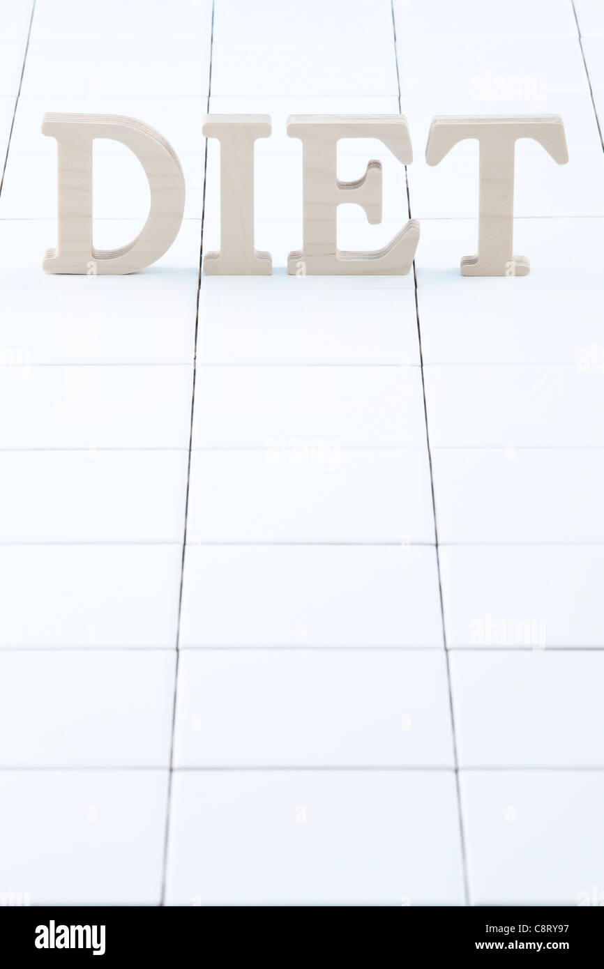 Close-up of text on tiled floor Stock Photo - Alamy