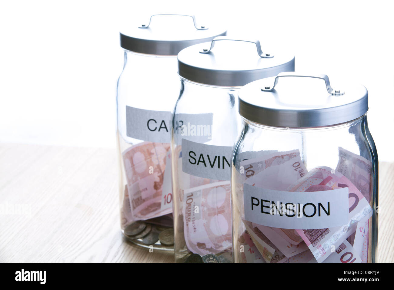 Three Jars With Currency Stock Photo - Alamy
