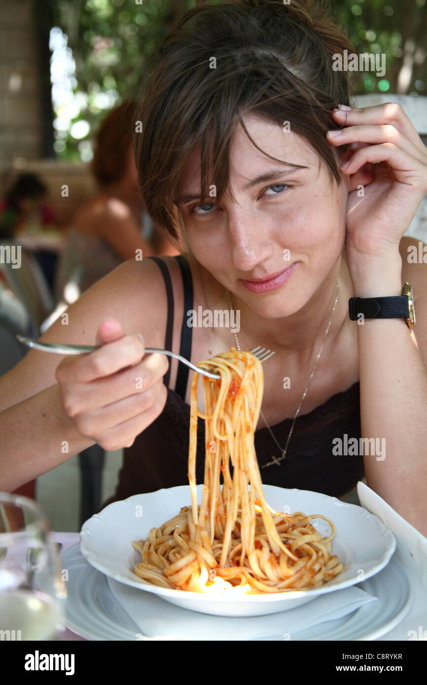 Woman eating spaghetti italy hi-res stock photography and images - Alamy