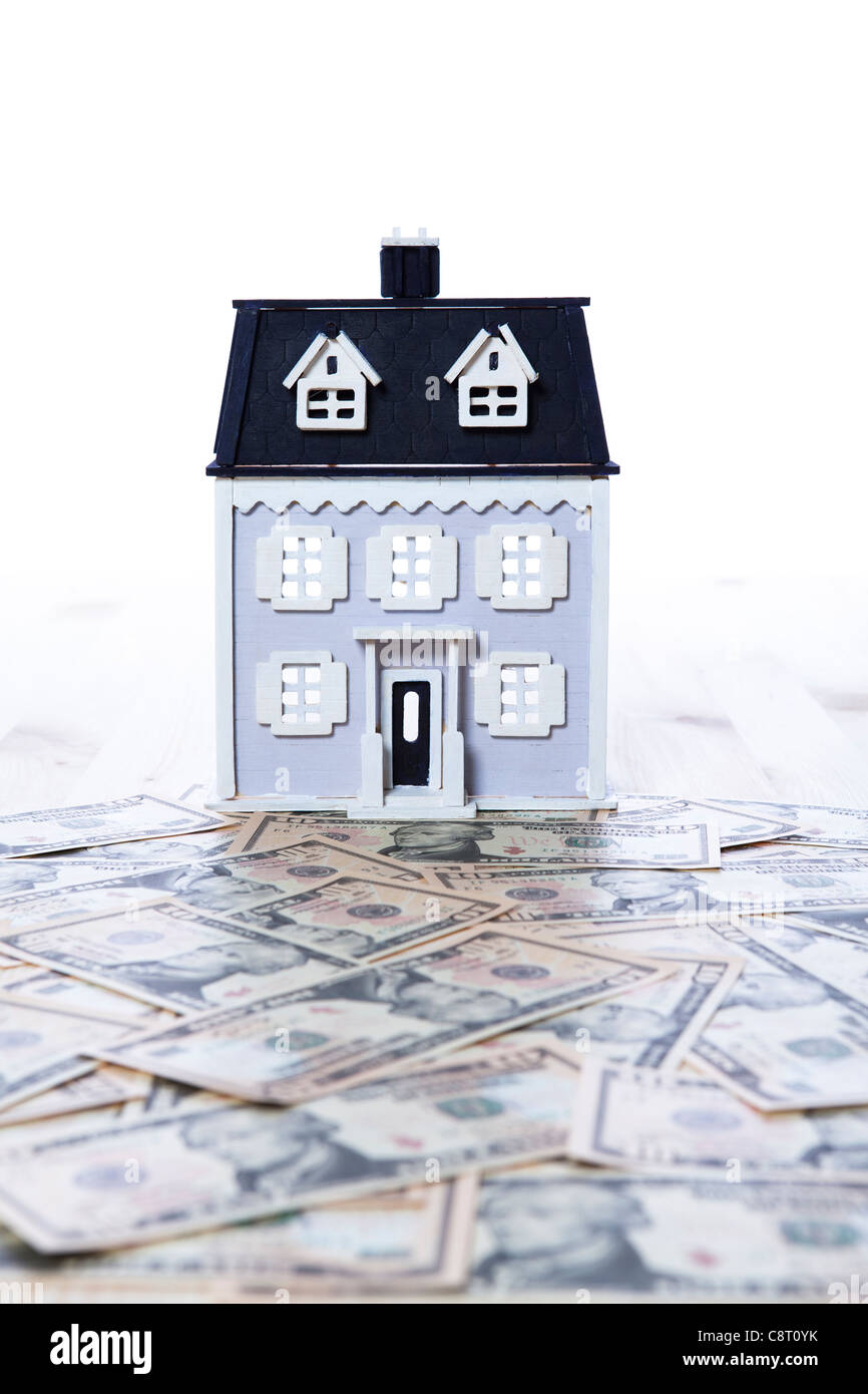 Architectural model of house on American currency notes Stock Photo - Alamy
