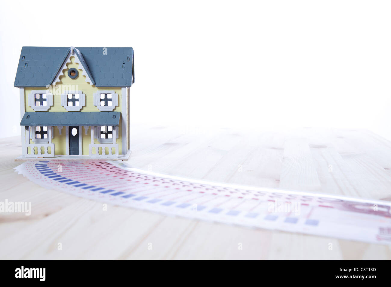 Model home with currency notes Stock Photo - Alamy