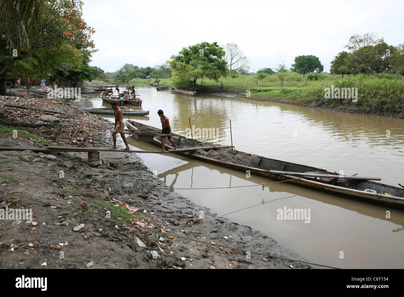 people dig sand from the bottom of the river Stock Photo - Alamy