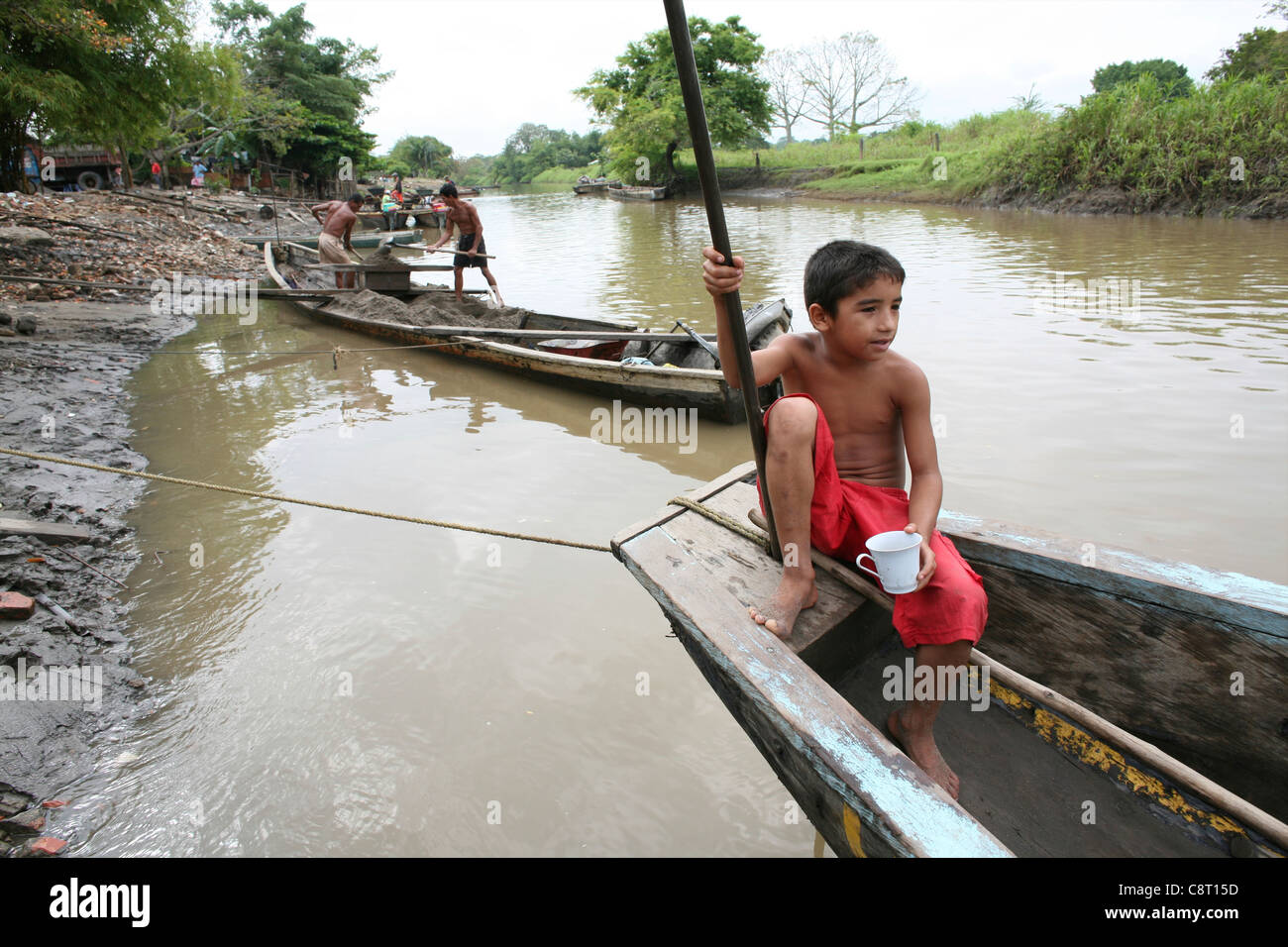 people dig sand from the bottom of the river Stock Photo - Alamy