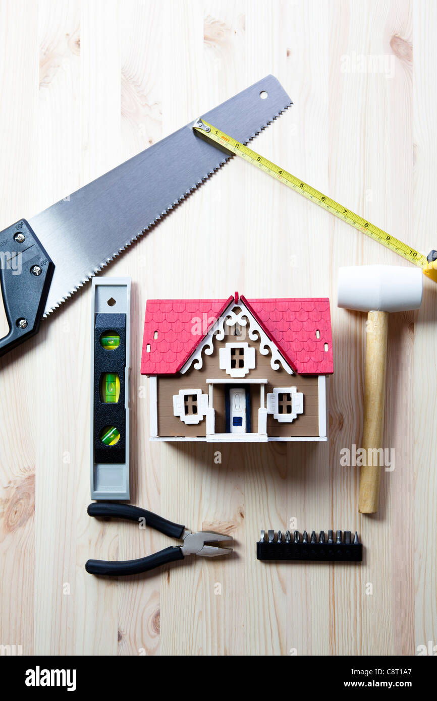 Carpentry Tools And House Model Stock Photo - Alamy