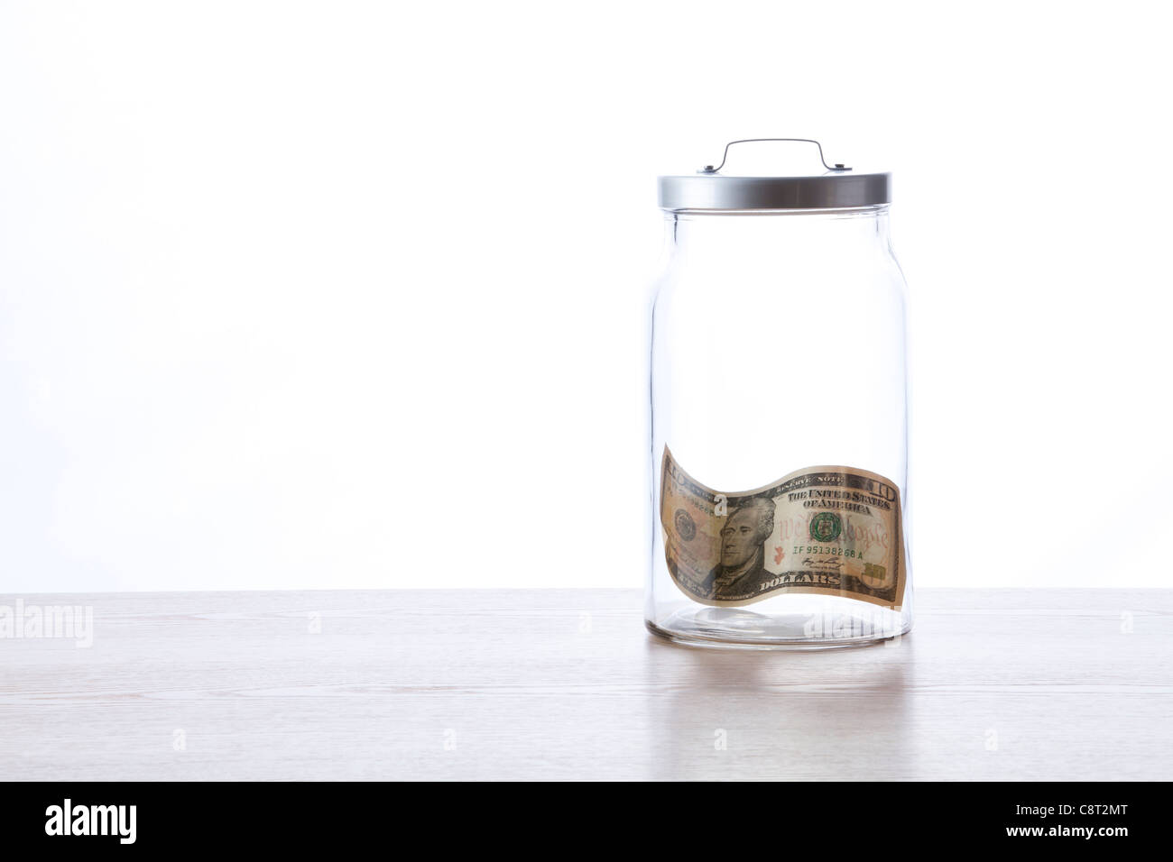 Currency Inside The Glass Jar Stock Photo - Alamy